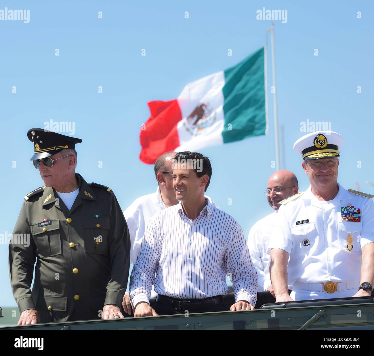 Mexican President Enrique Pena Nieto stands with Secretary of National ...