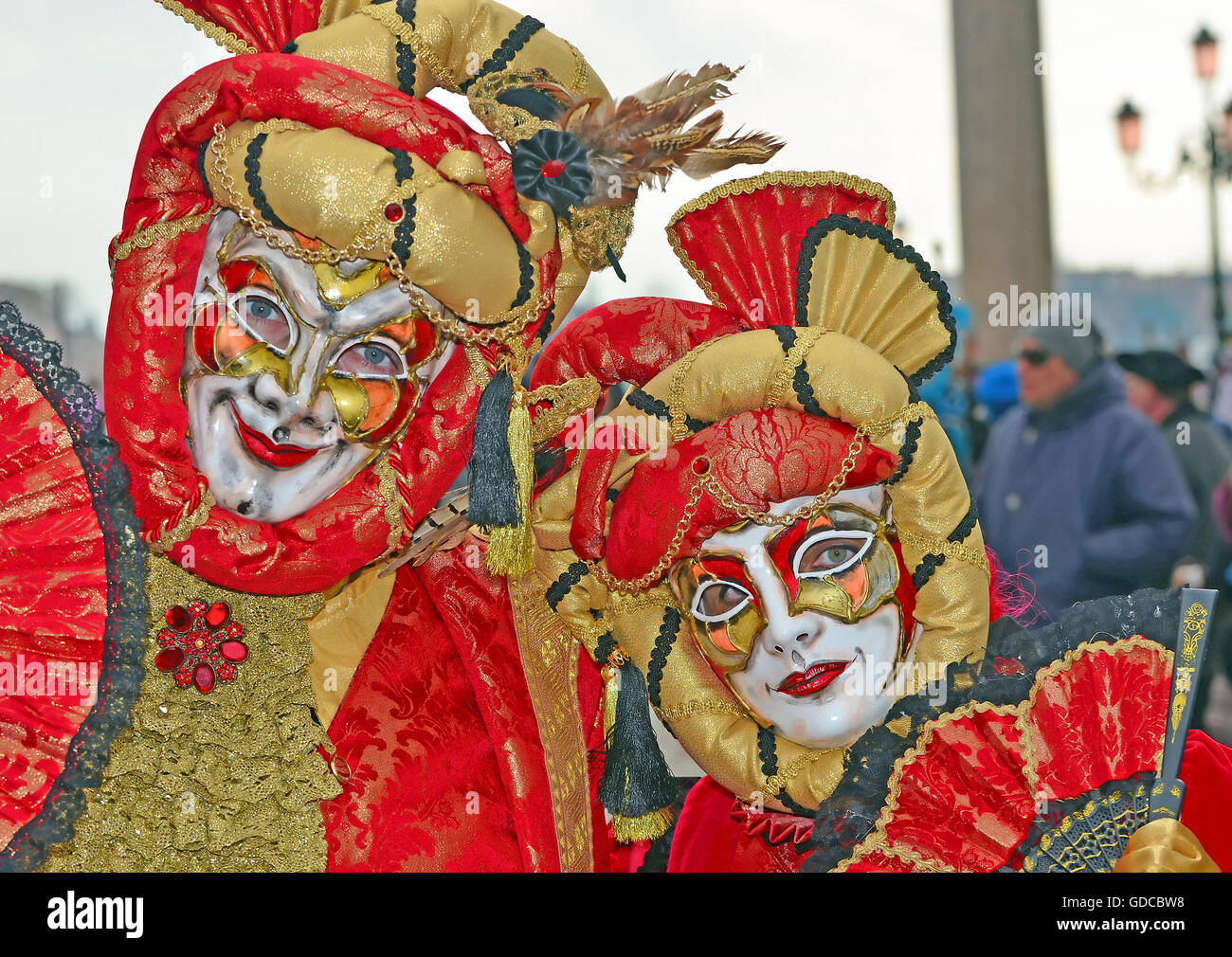 Italy couple of stunning jesters in red hi-res stock photography and ...