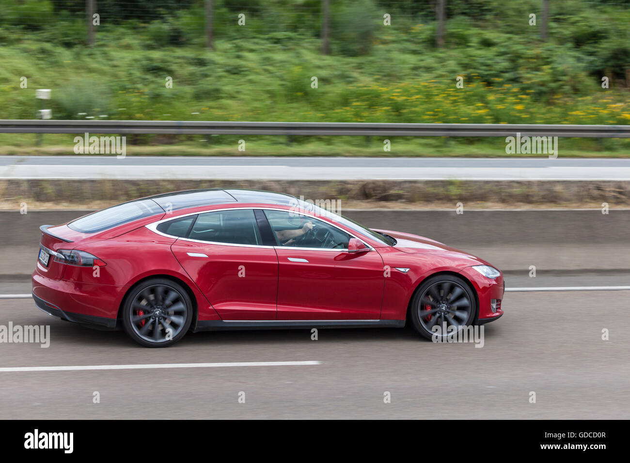 Tesla Model S on the highway Stock Photo - Alamy