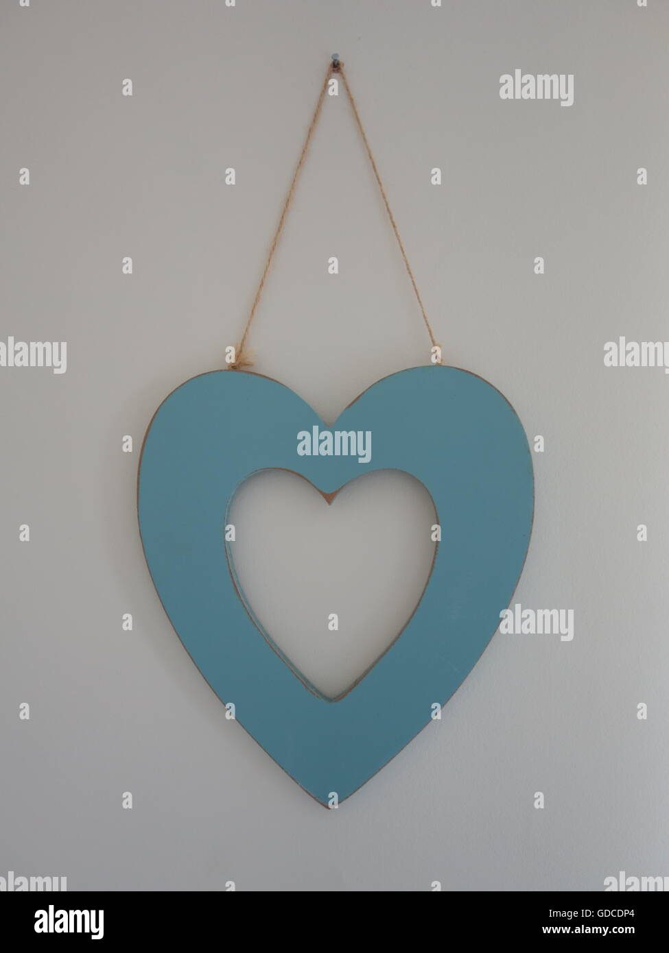 A wooden heart shaped wall hanging Stock Photo - Alamy