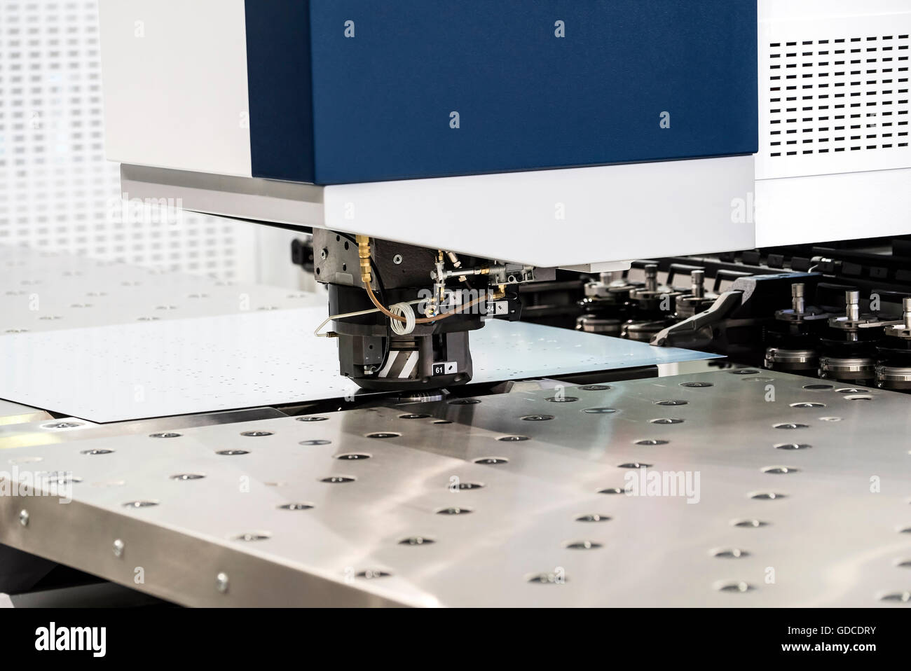 High-end machine for automatic punching metal sheet Stock Photo - Alamy