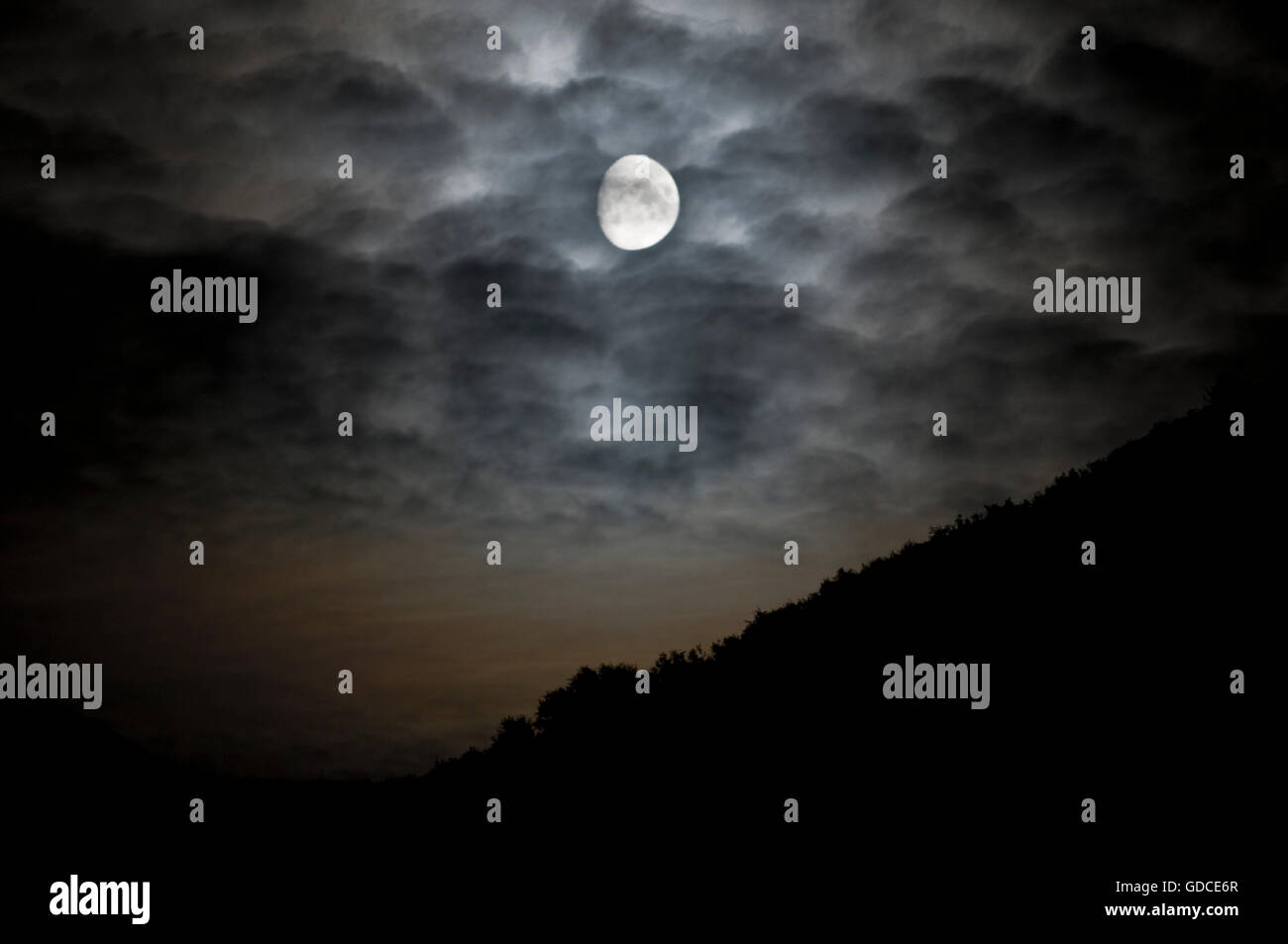 Clouded moon hi-res stock photography and images - Alamy