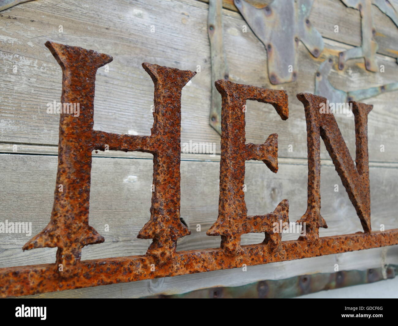 A rustic old sign with the word 'Hen Stock Photo - Alamy