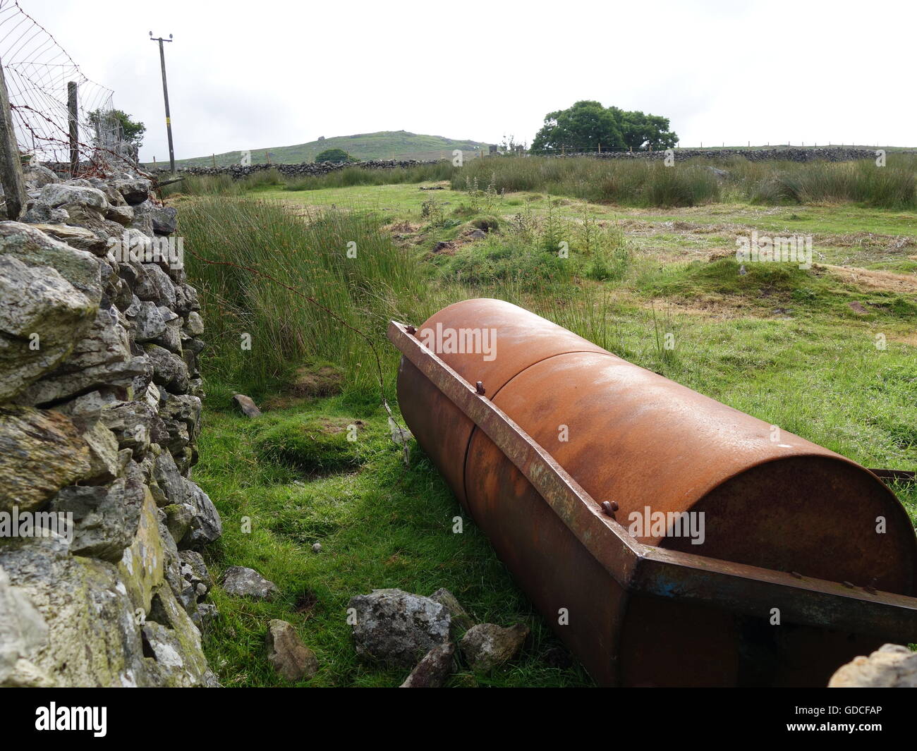 Farming implement in a field Stock Photo - Alamy