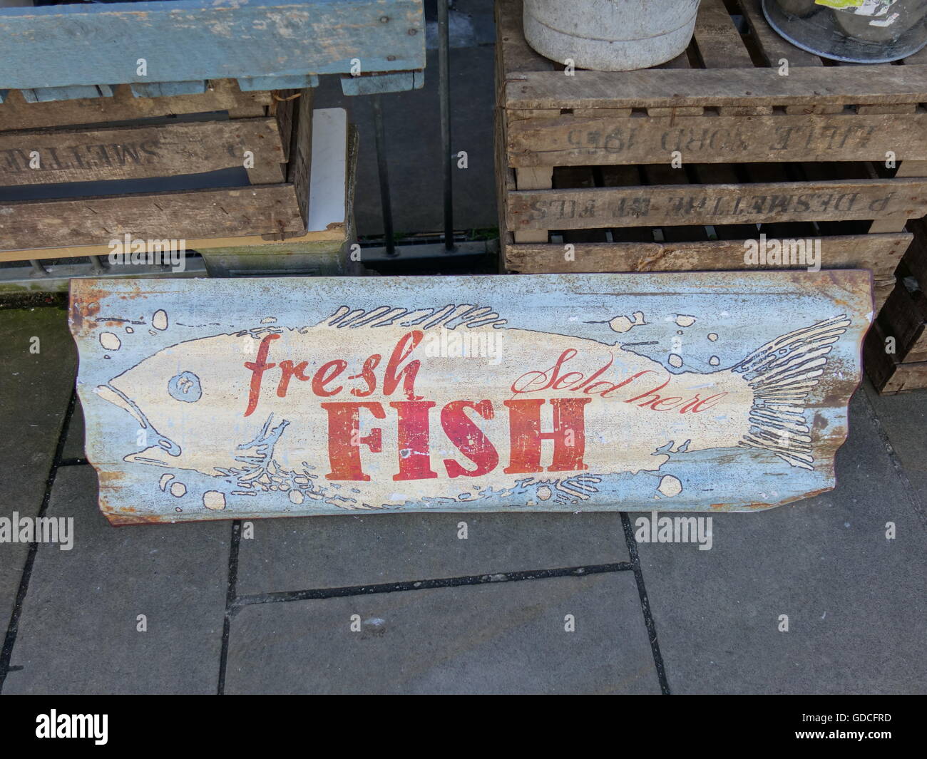 A 'fresh fish sold here' sign Stock Photo - Alamy