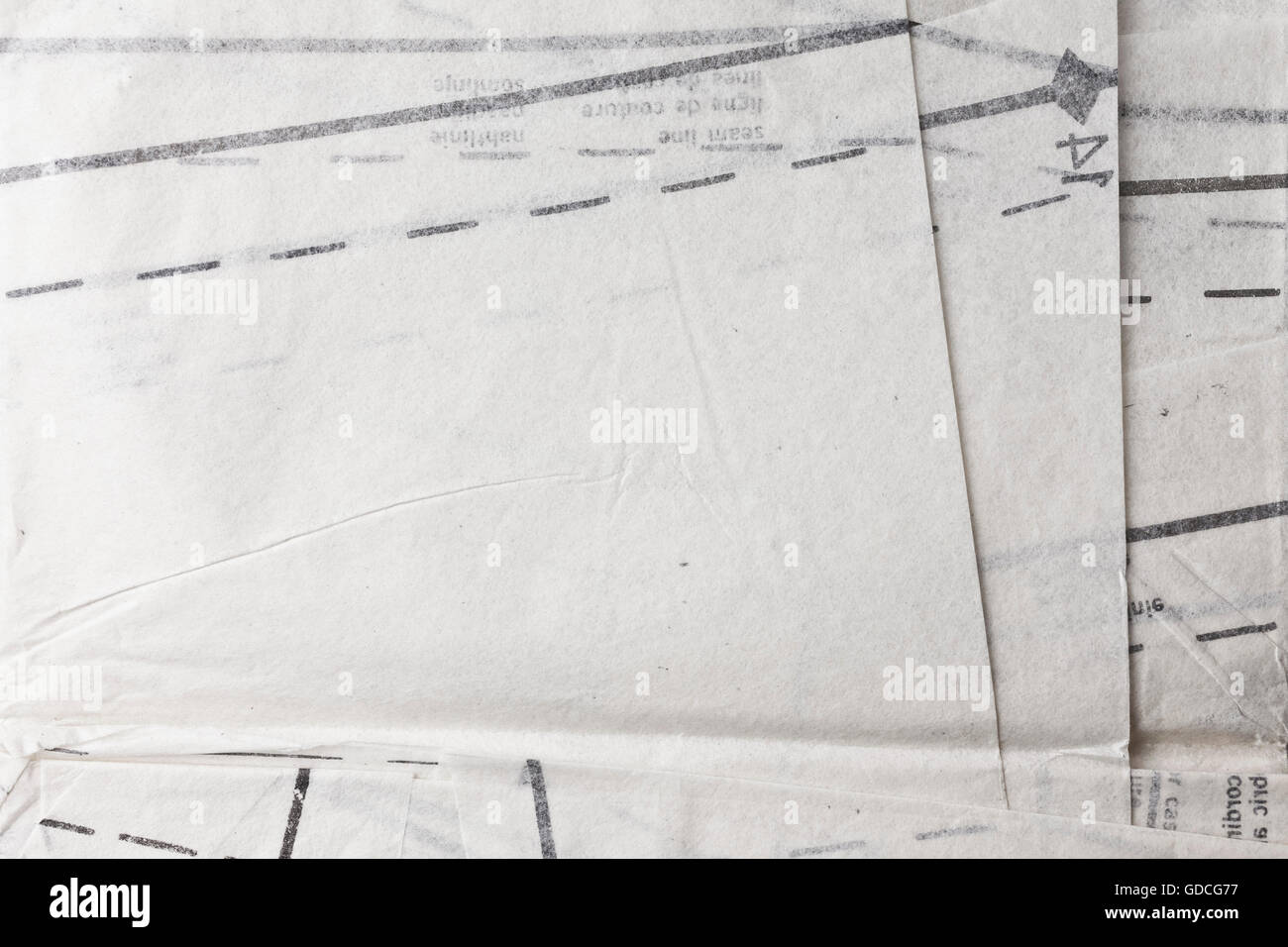 Sewing pattern on thin paper background Stock Photo - Alamy