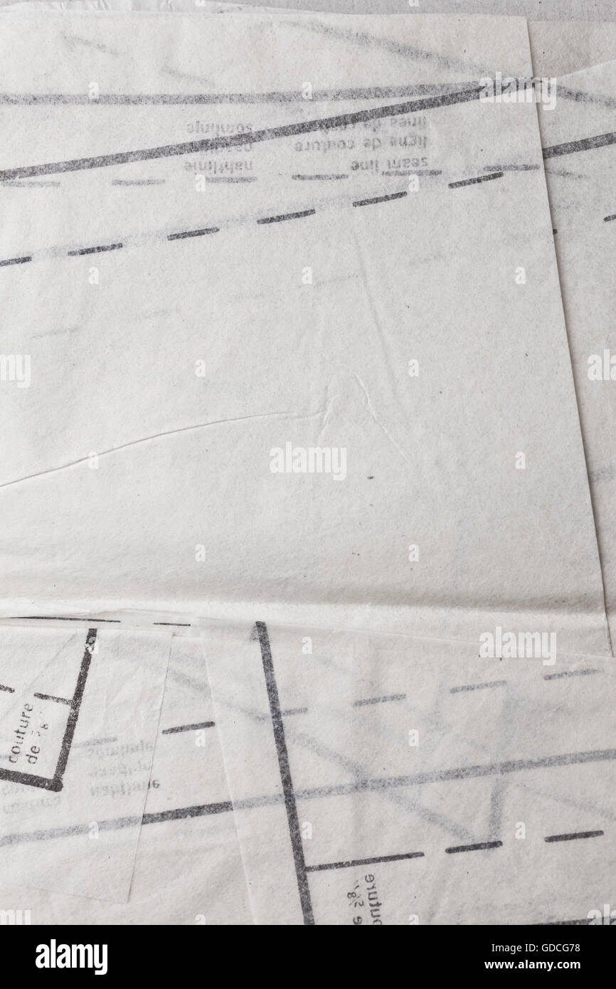 Sewing pattern on thin paper background Stock Photo - Alamy