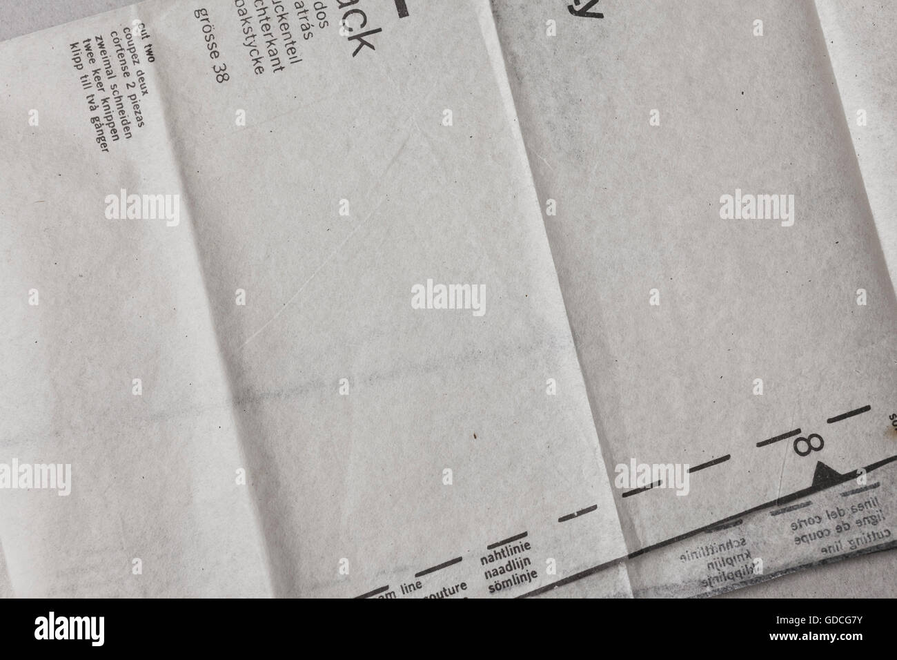 Sewing pattern on thin paper background Stock Photo - Alamy