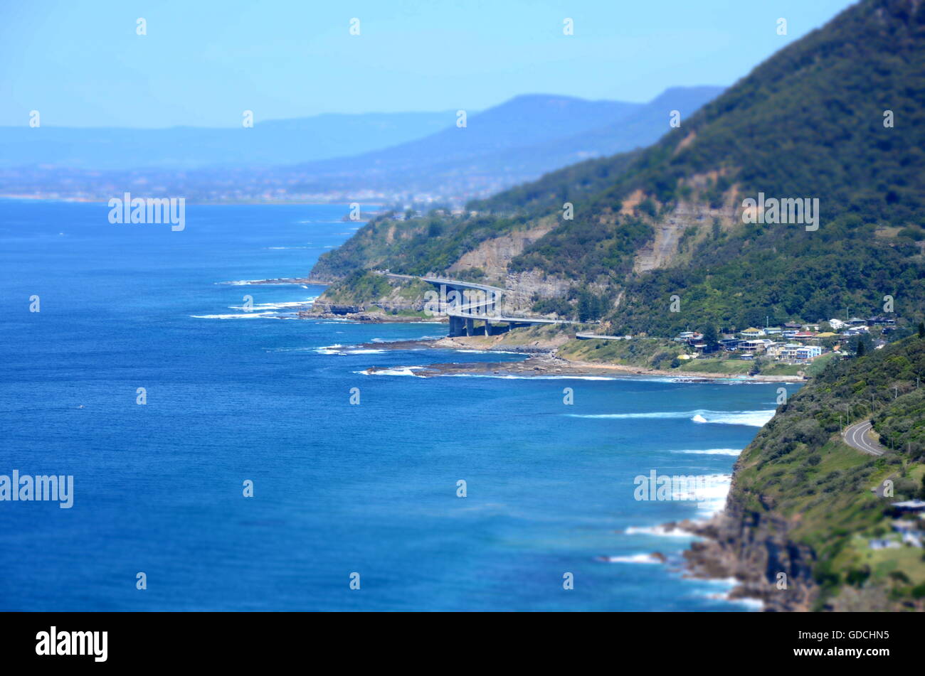 Panoramic view from Otford Lookout. The Sea Cliff Bridge is a balanced ...
