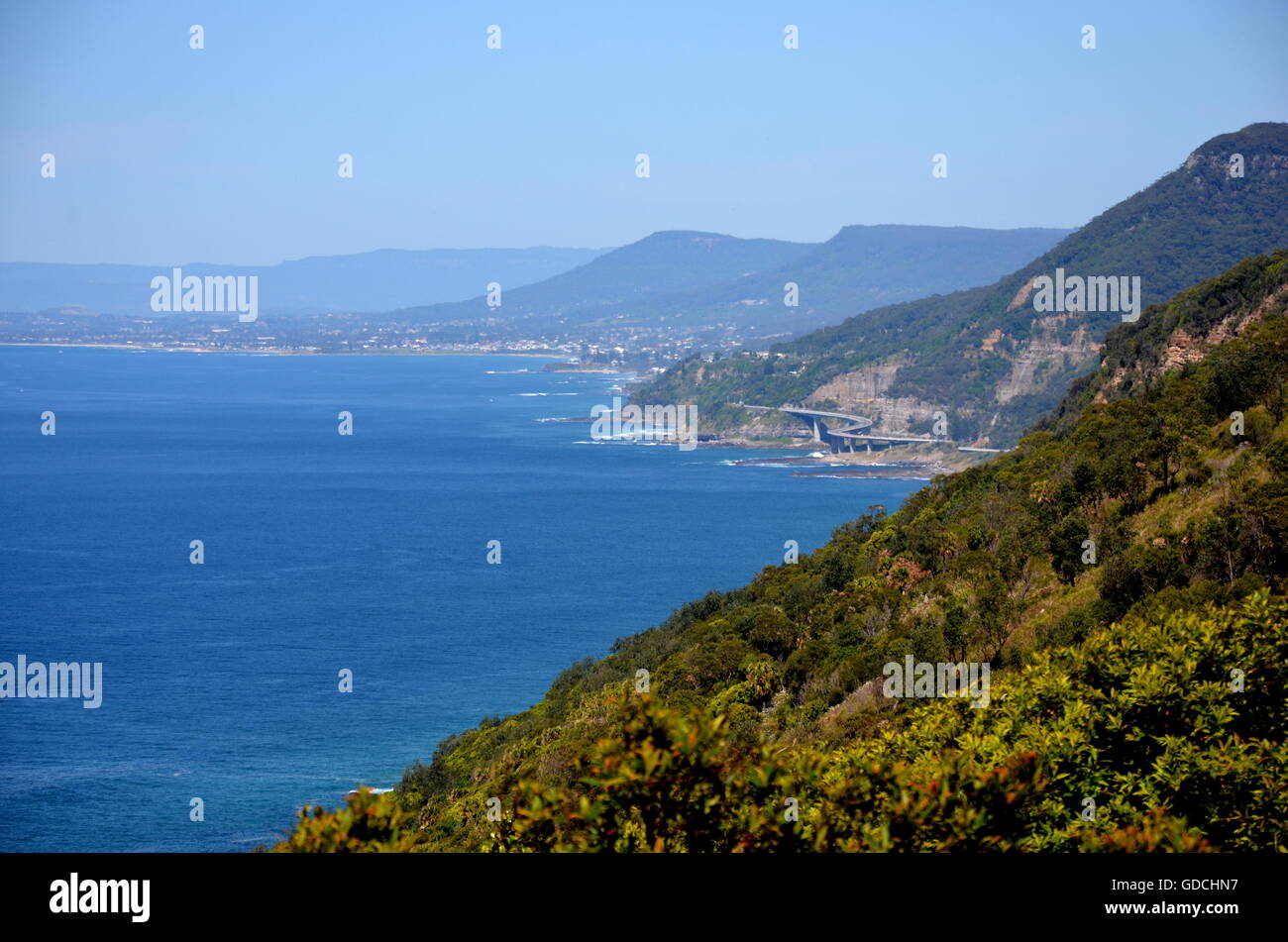 Panoramic view from Otford Lookout. The Sea Cliff Bridge is a balanced ...