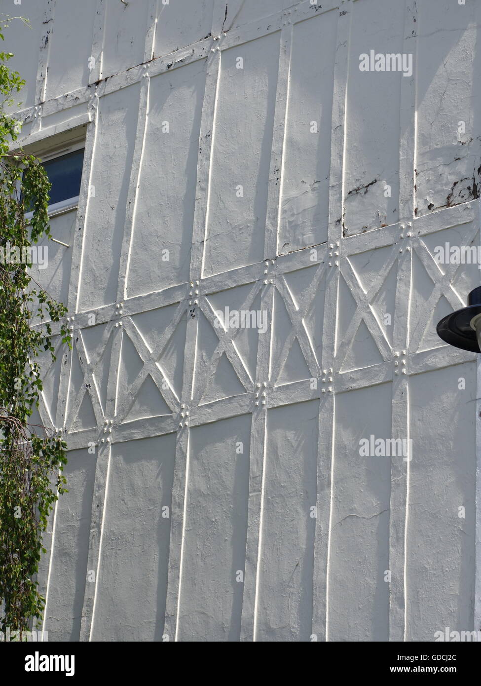 The pattern on the side of an old building Stock Photo - Alamy