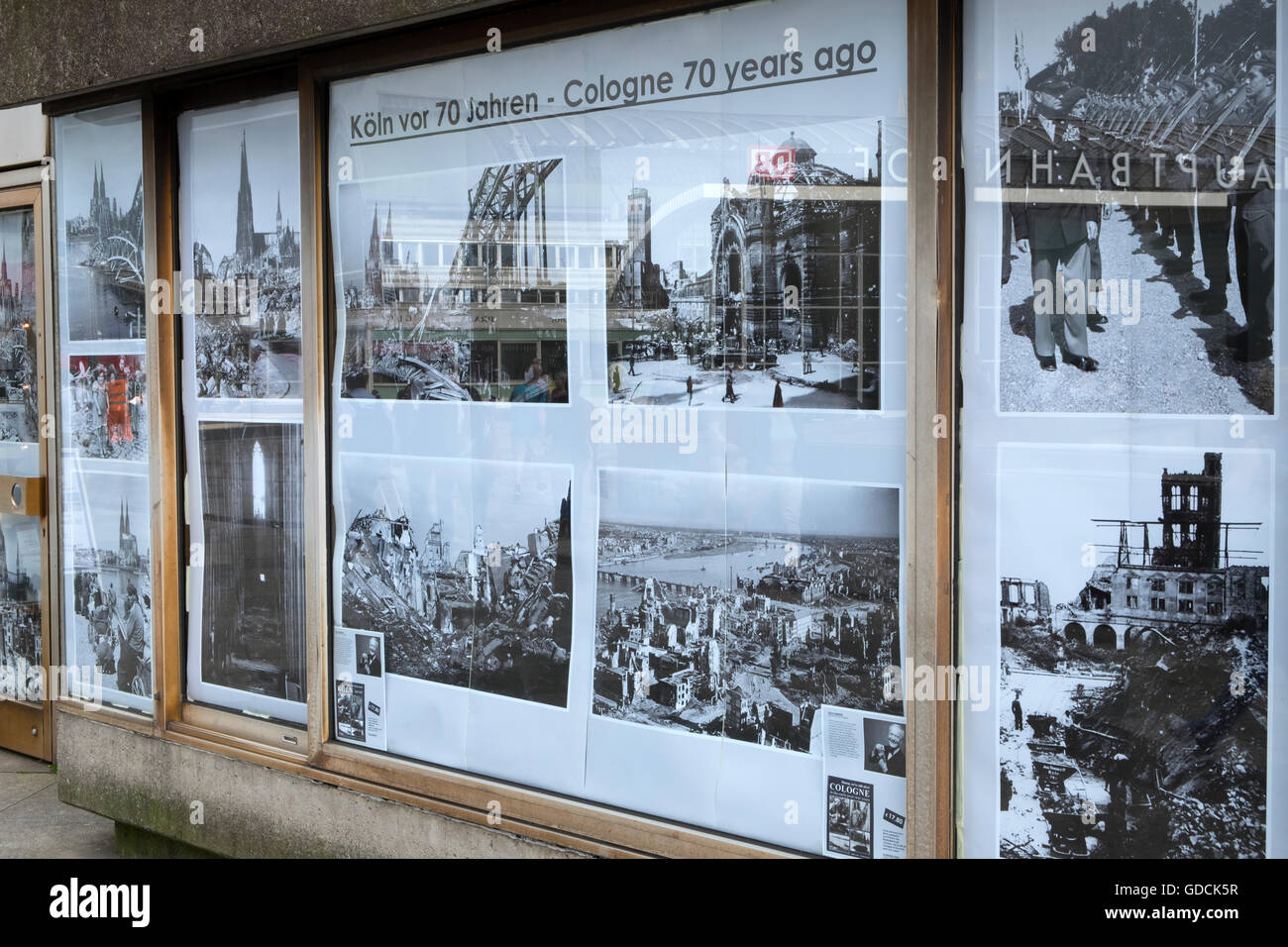 Display of photographs in shop window of the city of Cologne after WW2 ...