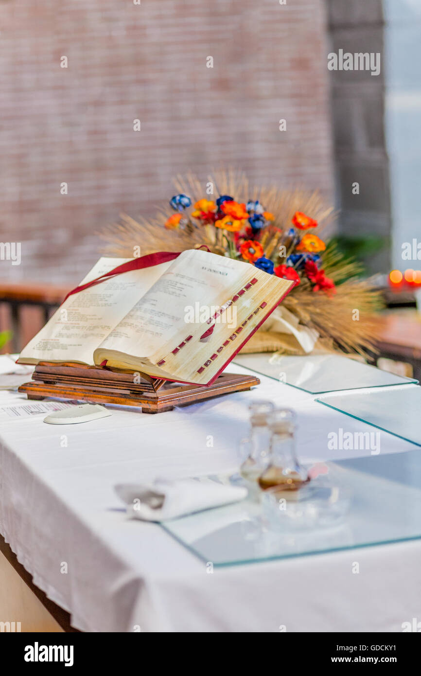 the spirituality of an open Bible on the altar of the Catholic Church ...