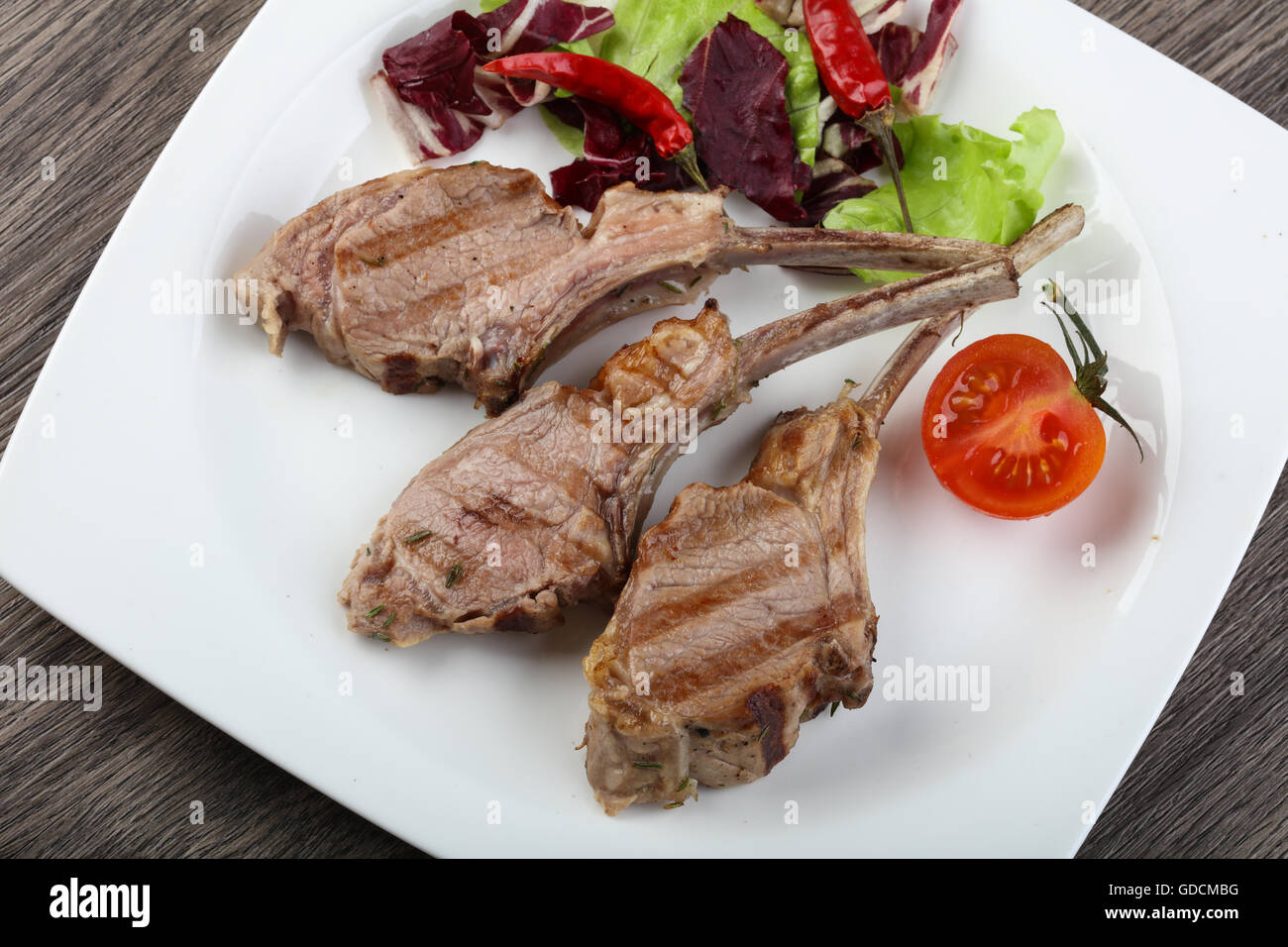 Lamb Frenched Rack grilled rib bone Stock Photo - Alamy