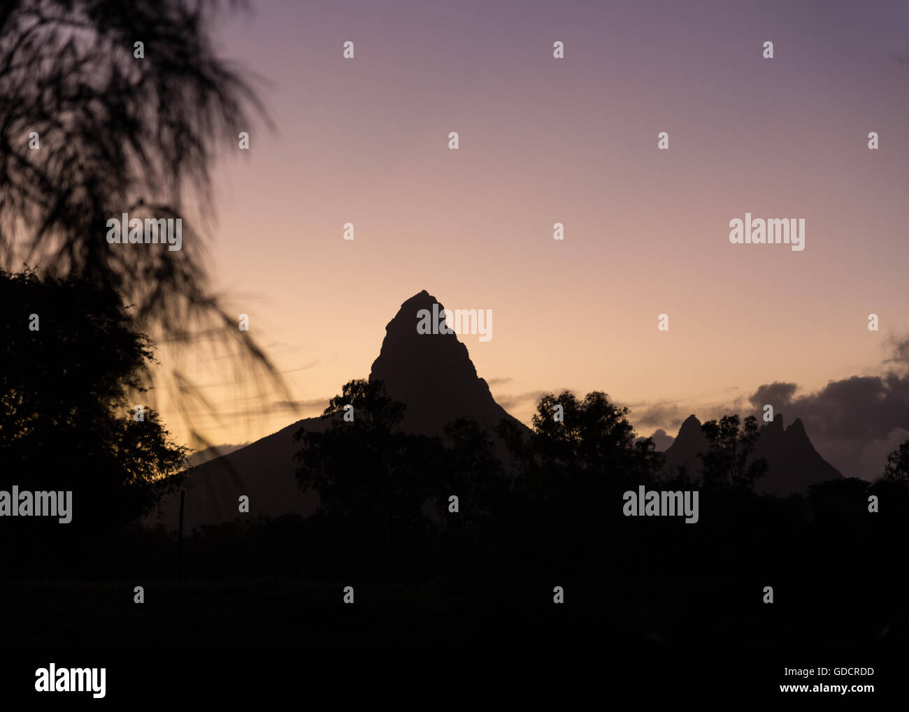 Piton de la Petite silhouette at sunrise Panorama Mauritius Stock Photo ...