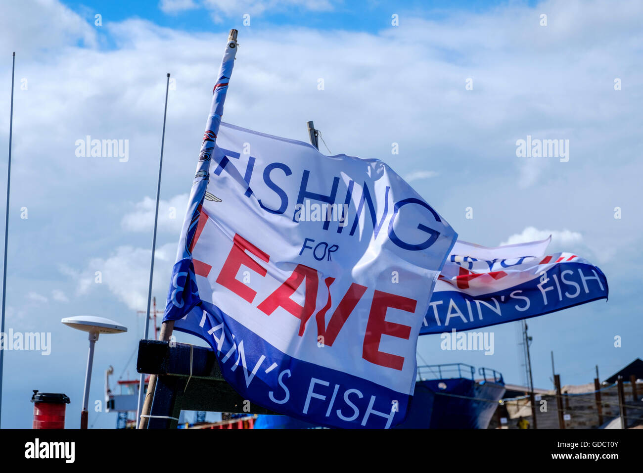 Fishing for LEAVE flags on fishing boats in Whitstable, Kent England ...