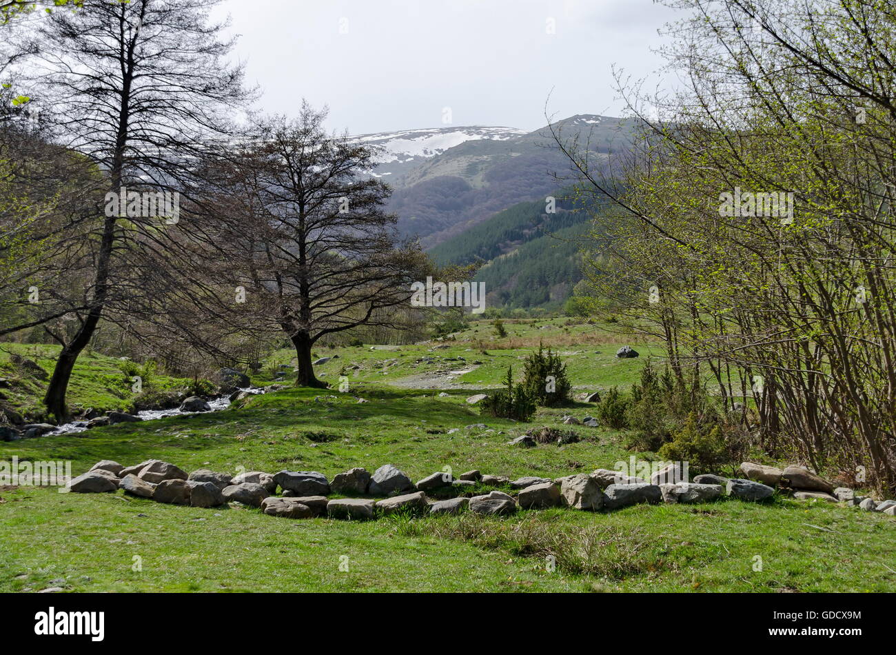 Mountain landscape with river and interesting path toward bridge ...