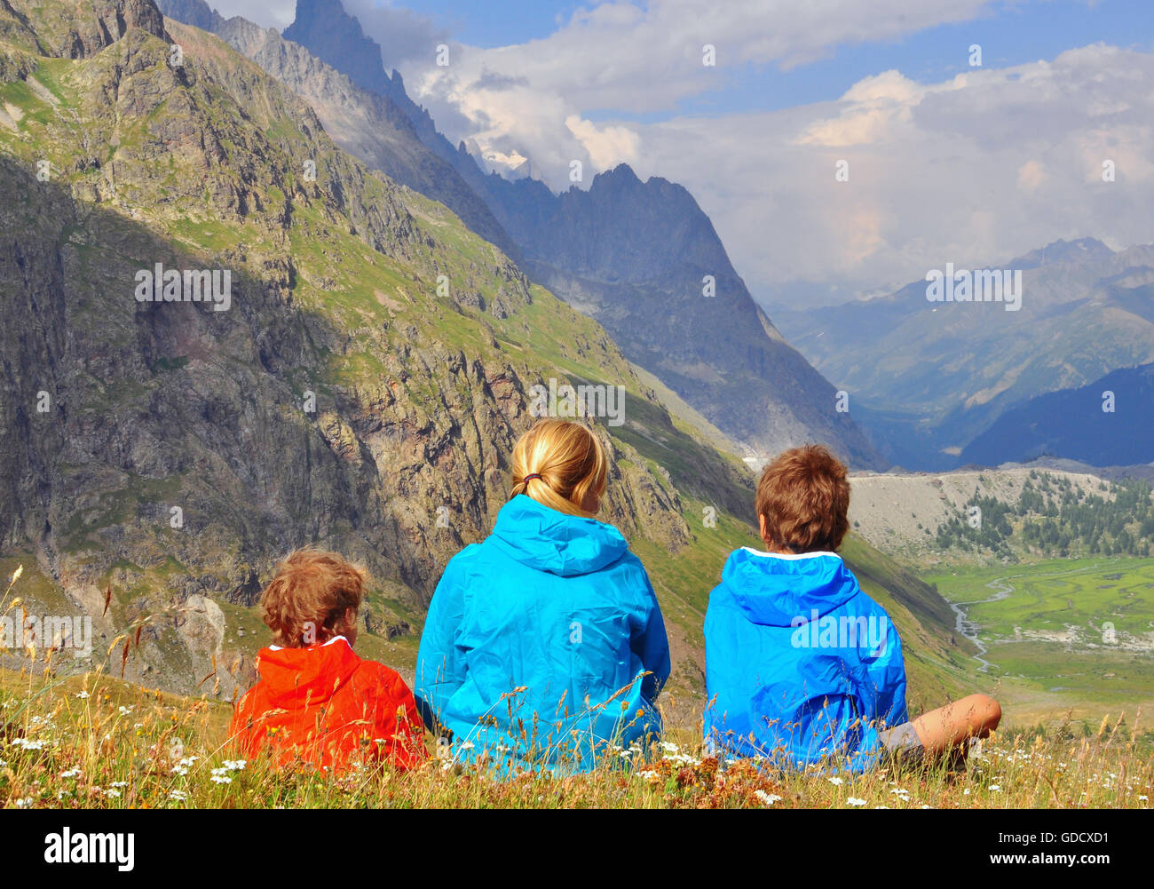 Family in mountains, back view Stock Photo - Alamy