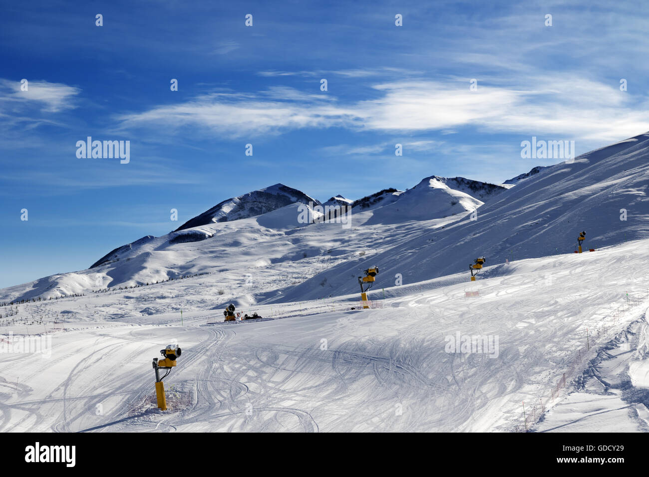 Ski slope with snowmaking at sun morning. Greater Caucasus, Mount ...