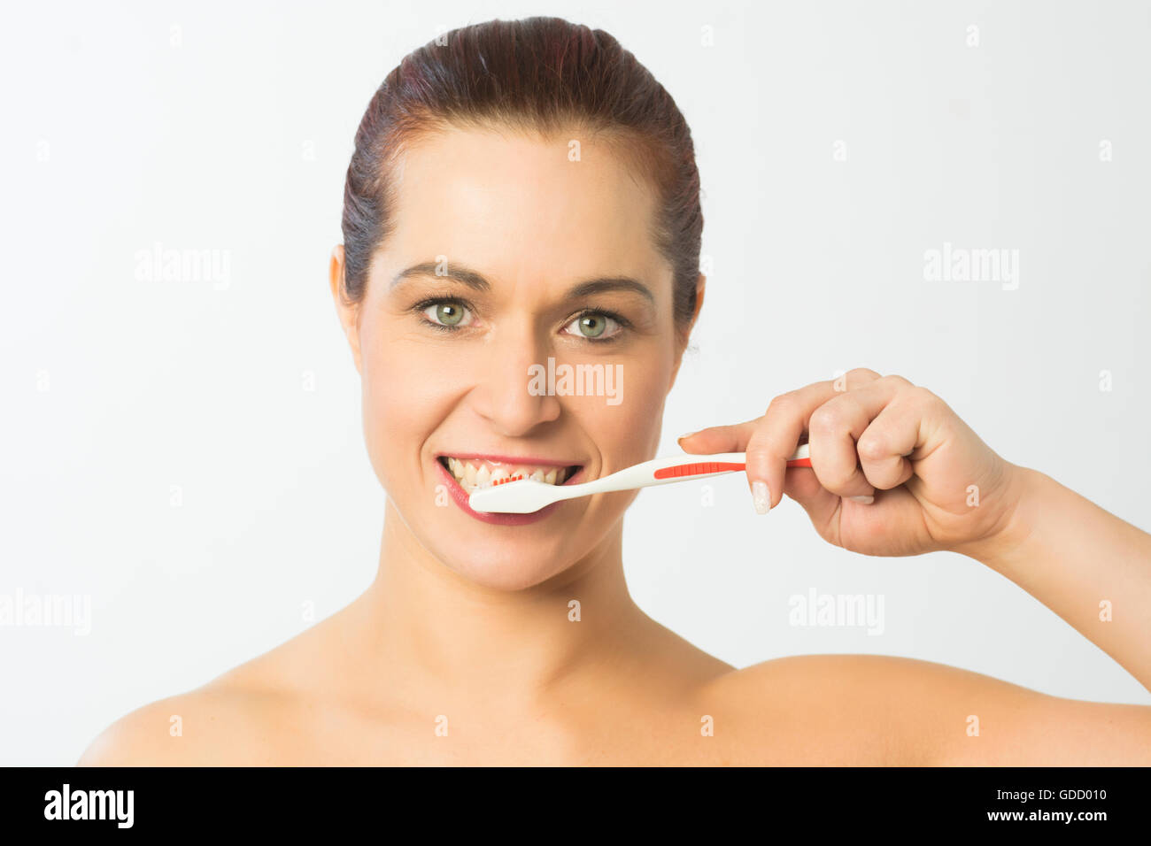 Woman hand holding toothbrush hi-res stock photography and images - Alamy