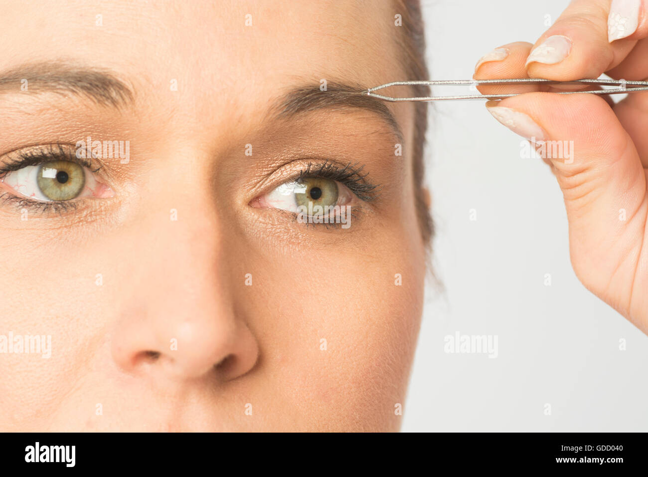 A single hair tweezers hi-res stock photography and images - Alamy