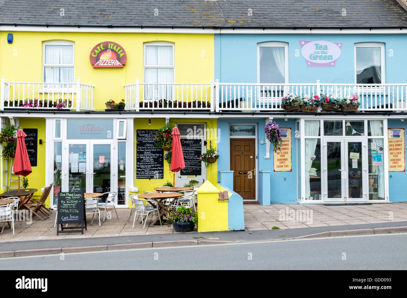 Seaside cafes in bright colours in Westward Ho! North Devon, England ...