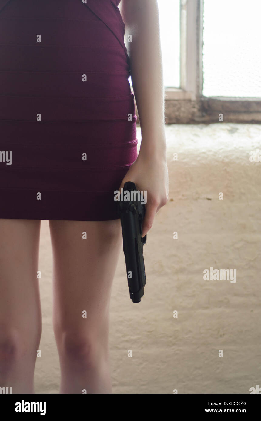 Woman holding gun her hand hi-res stock photography and images - Alamy