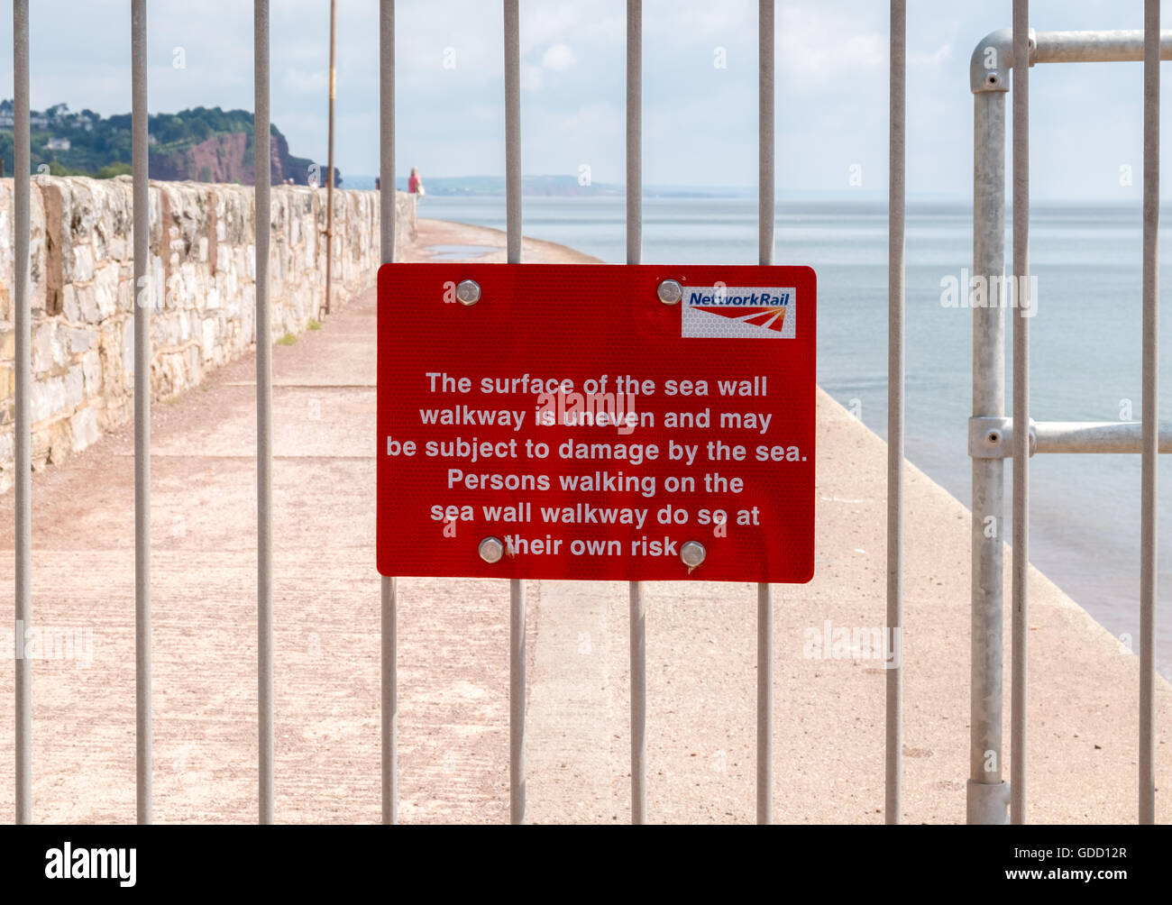 Network rail warning sign on the sea wall at Teignmouth near Dawlish ...