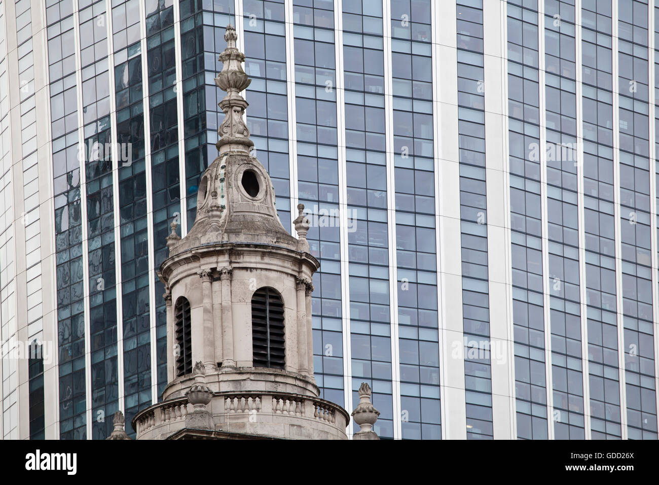 Old church monuments in London on a background of modern buildings ...