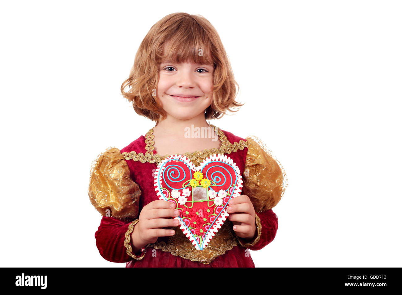 little girl holding gingerbread heart Stock Photo - Alamy