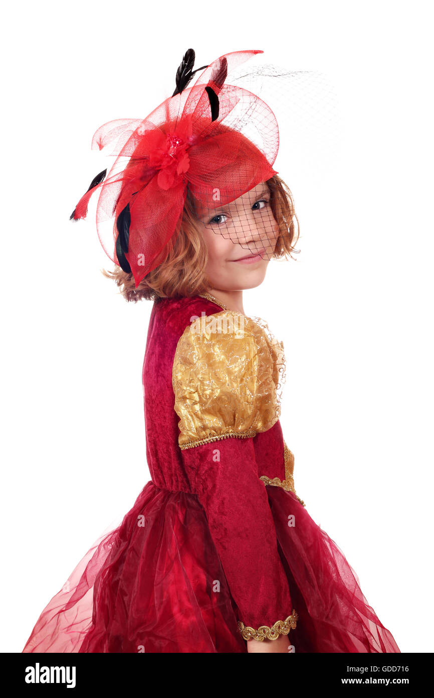 little girl in golden and red dress posing Stock Photo - Alamy