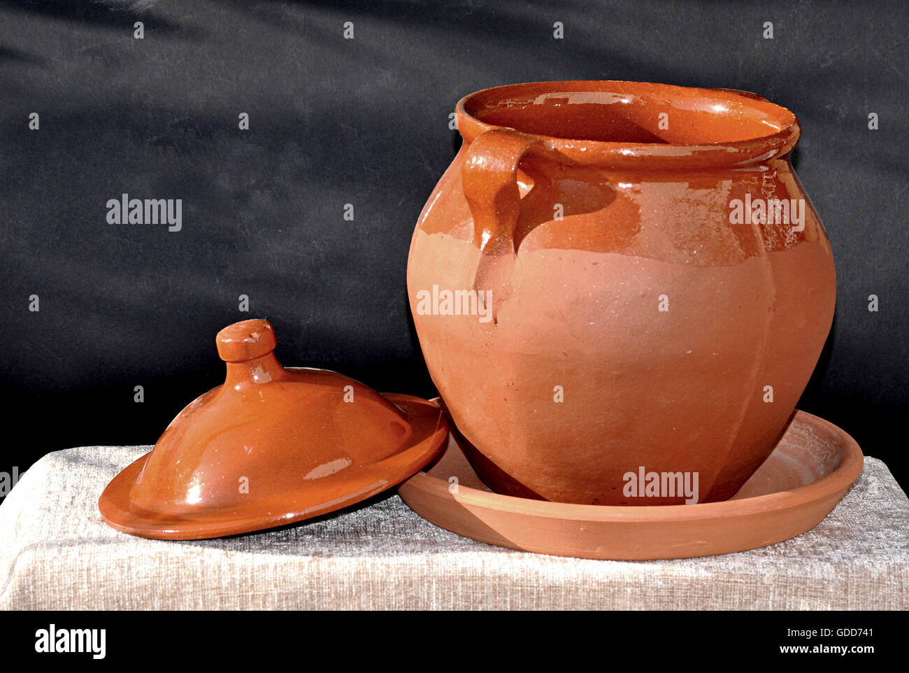 clay pot with lid on table Stock Photo - Alamy