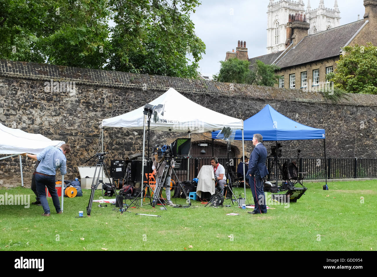 A BBC news reporter filing a report from outside the Houses of ...