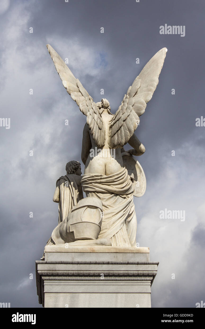 Angel statue from behind showing backside Stock Photo - Alamy