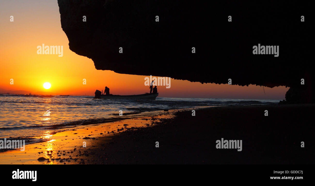 Fischer and rock,cliff,in,evening light Stock Photo - Alamy