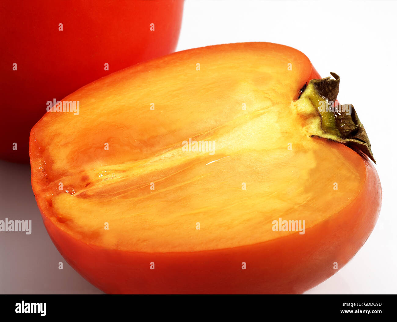 PERSIMMON FRUIT OR KAKI OR SHARON FRUIT diospyros kaki AGAINST WHITE ...