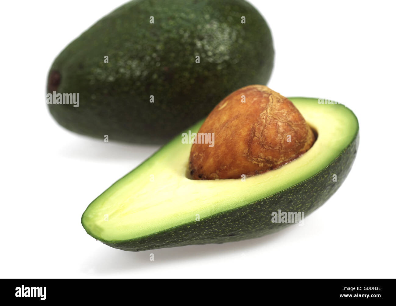 AVOCADO AGAINST WHITE BACKGROUND Stock Photo - Alamy