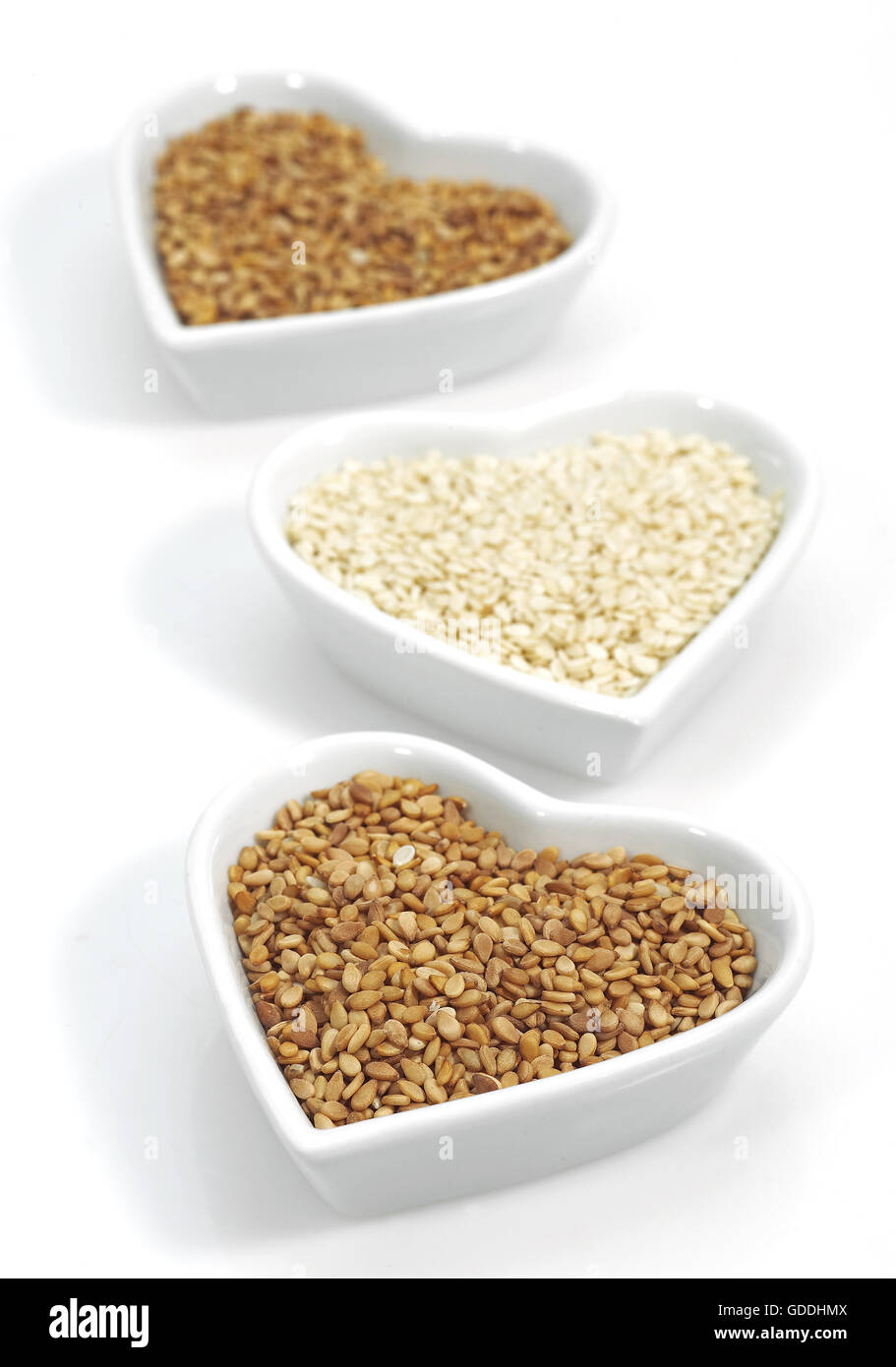 GOLD COLOURED SESAM AND NATURAL SESAM SEEDS Stock Photo - Alamy