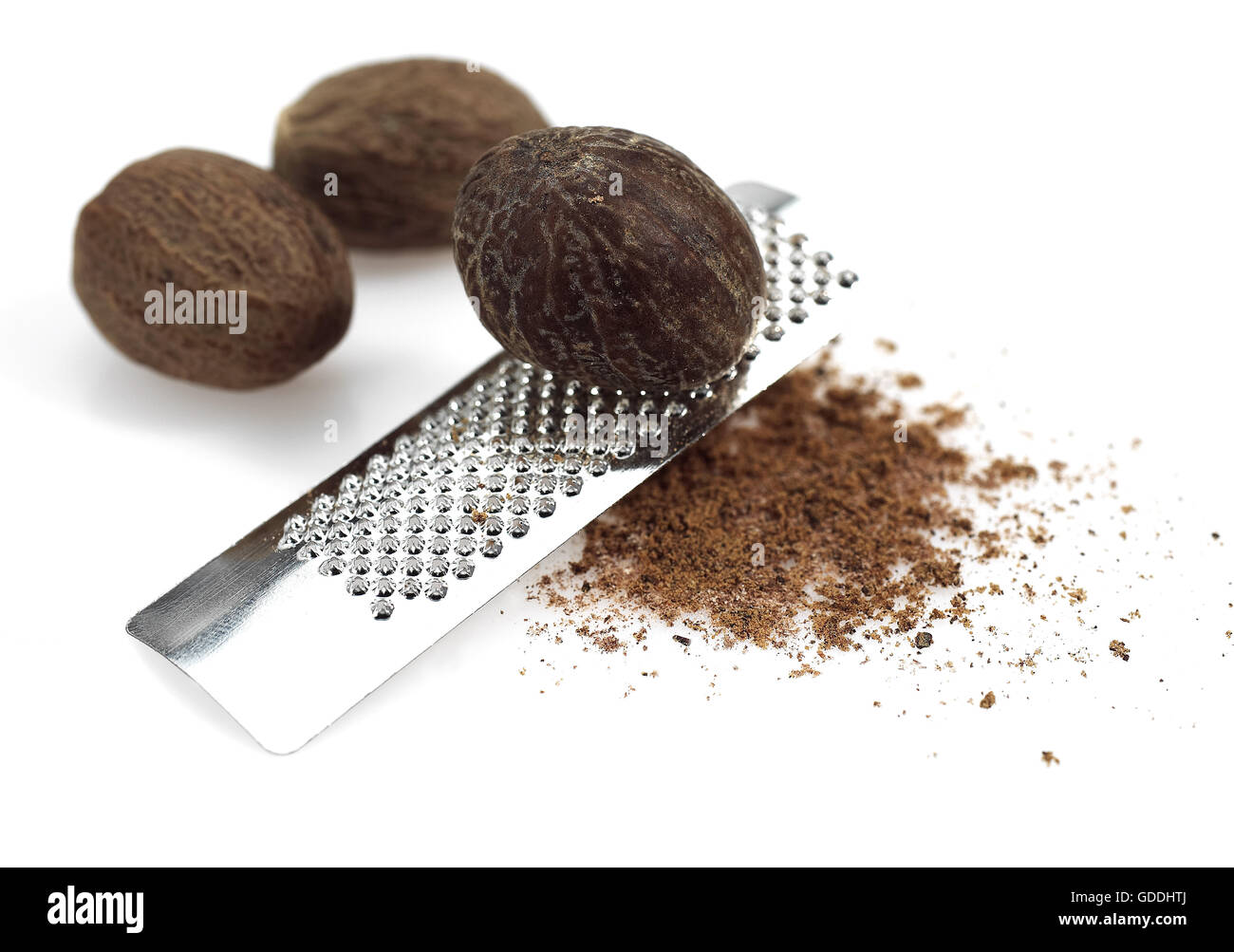 Nutmeg, myristica fragrans, Fruit, Powder and Grater against White ...