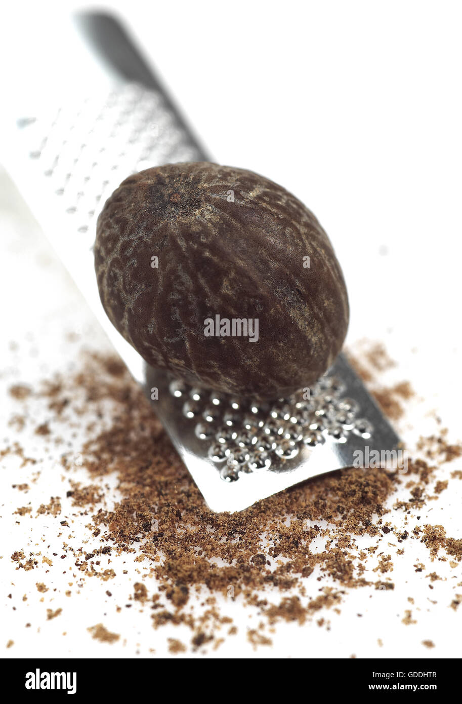 Nutmeg, myristica fragrans, Fruit, Powder and Grater against White ...