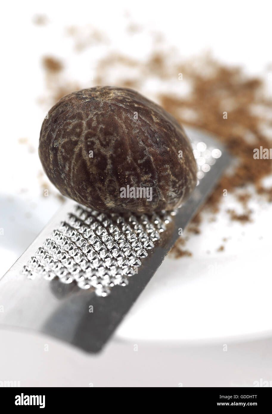 Nutmeg, myristica fragrans, Fruit, Powder and Grater against White ...