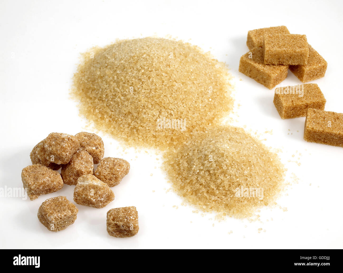 Cubes and Powder of Brown Sugar against White Background Stock Photo ...