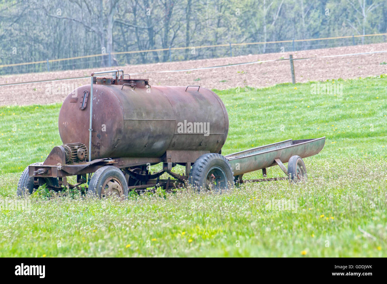 The old cistern forgotten in the pasture for the cows Stock Photo - Alamy