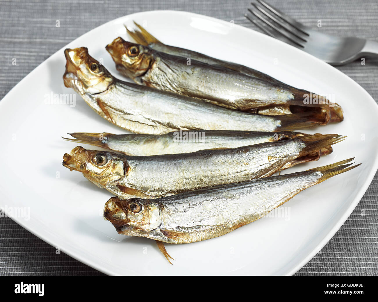 Sprat Fish, sprattus sprattus, Smoked Fishes in a Plate Stock Photo - Alamy