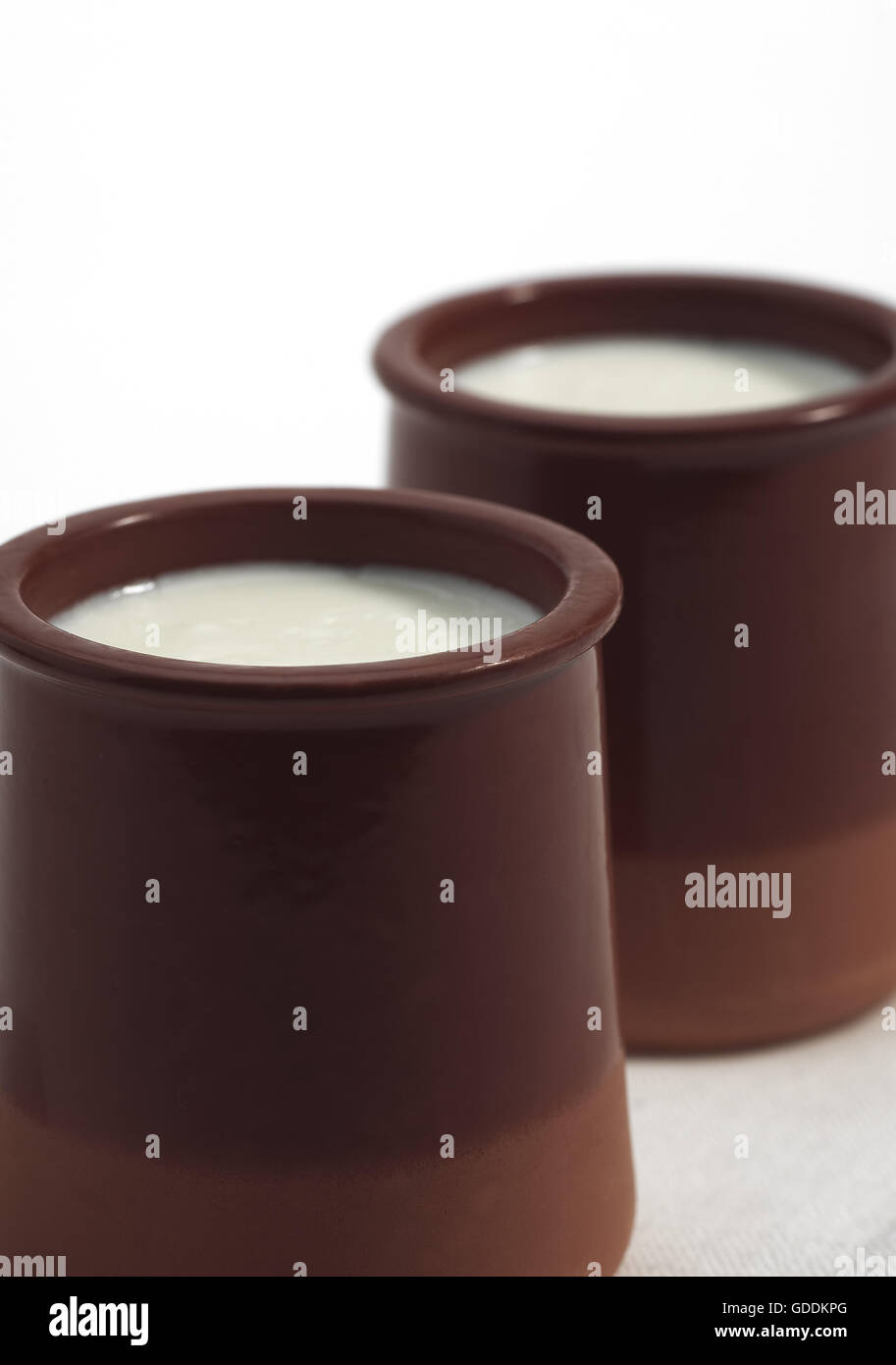 Pot of Yogurt against White Background Stock Photo - Alamy