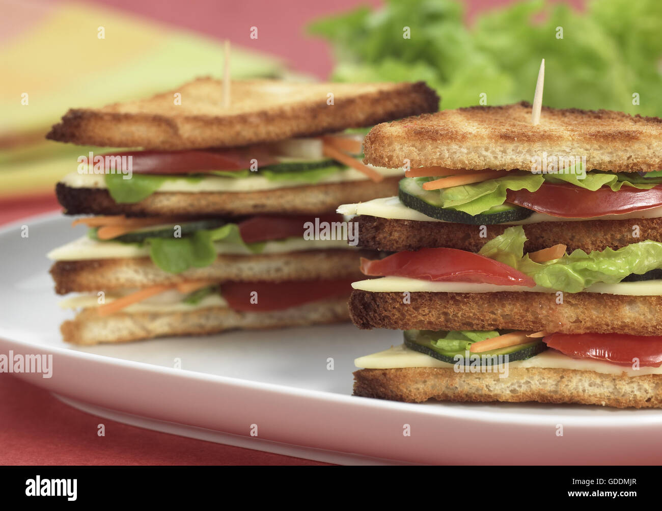 FAST FOOD, CLUB SANDWICH WITH SALAD AND TOMATO Stock Photo - Alamy