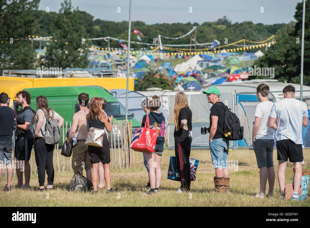 Henham Park, Suffolk, UK. 15th July, 2016. Queueing for the shower ...