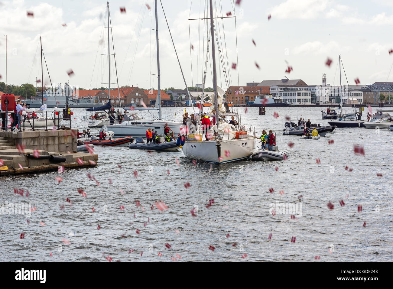 Mini flags flying in the air when the sailing boat Havana returns to ...