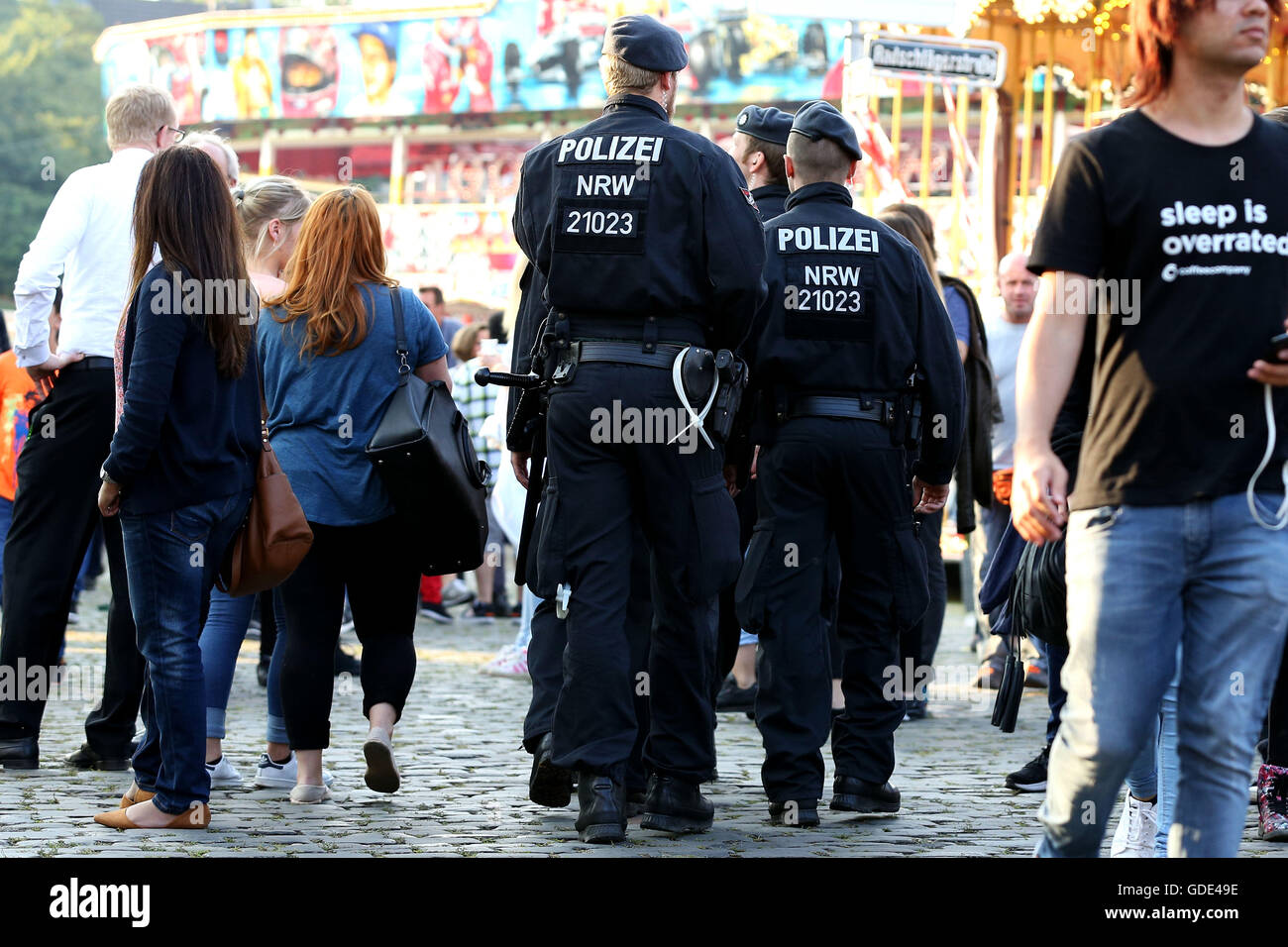 Duesseldorf, Germany. 15th July, 2016. Police officers walk across the ...