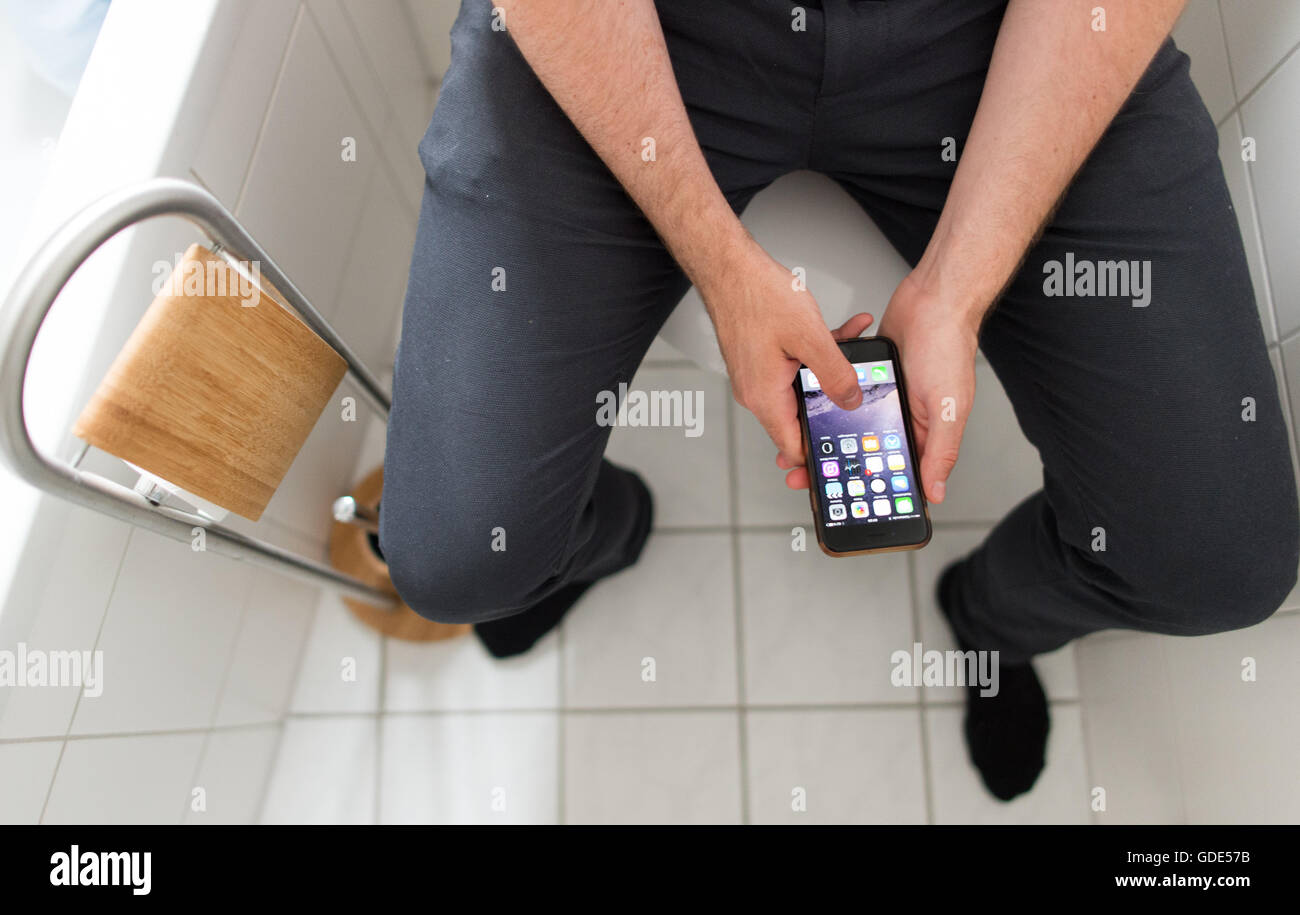 Man on toilet illustration hi-res stock photography and images - Alamy
